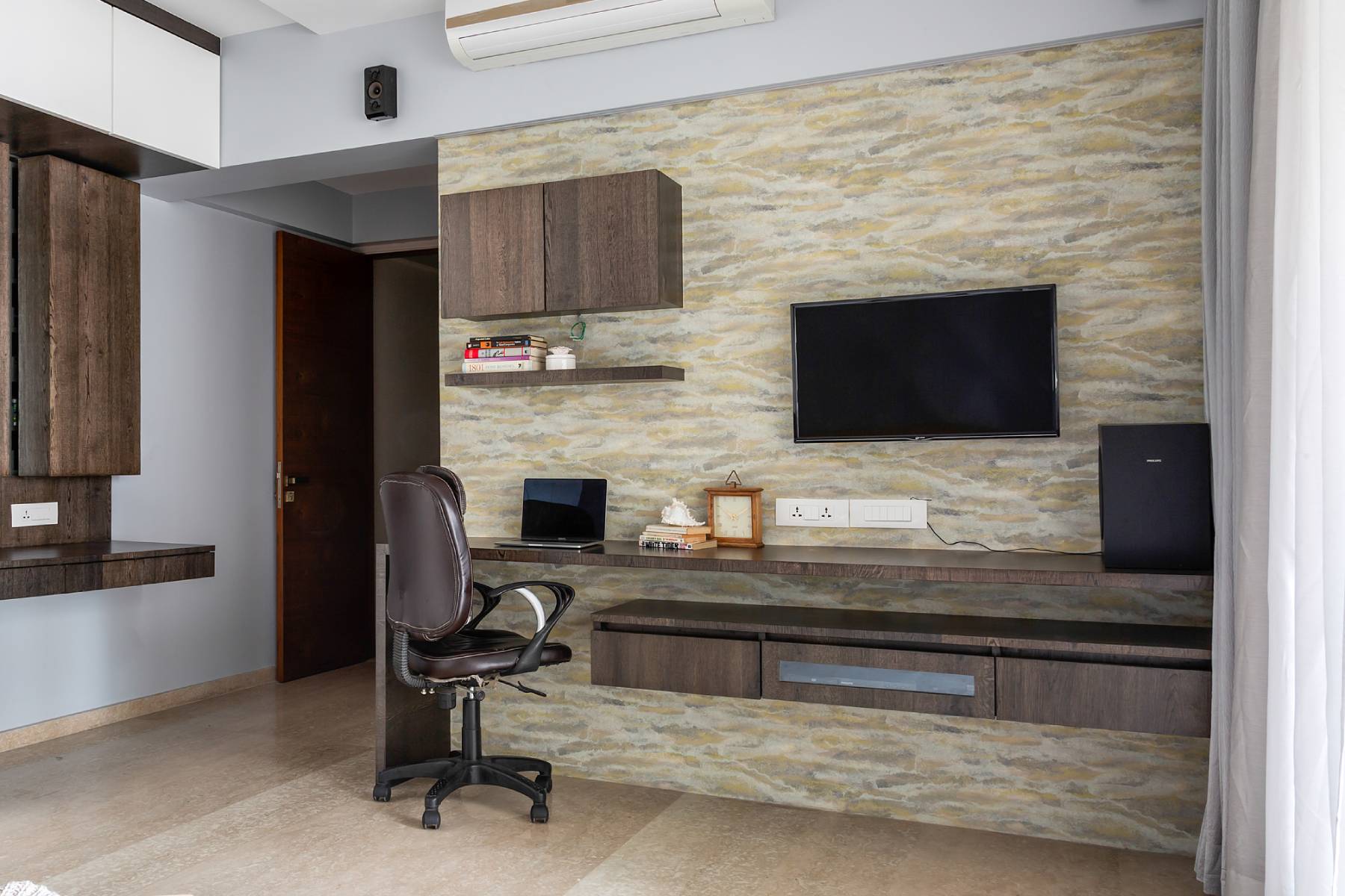 Spacious Wooden Study Room Design With TV Unit | Livspace