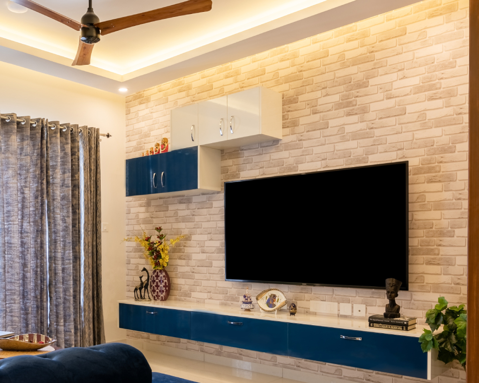 Neutral-Toned Living Room Wallpaper Highlighted By Cove Lighting | Livspace