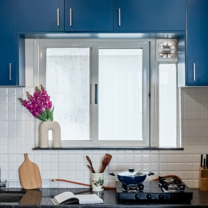 Kitchen Window Design With An Exhaust Fan Opening | Livspace