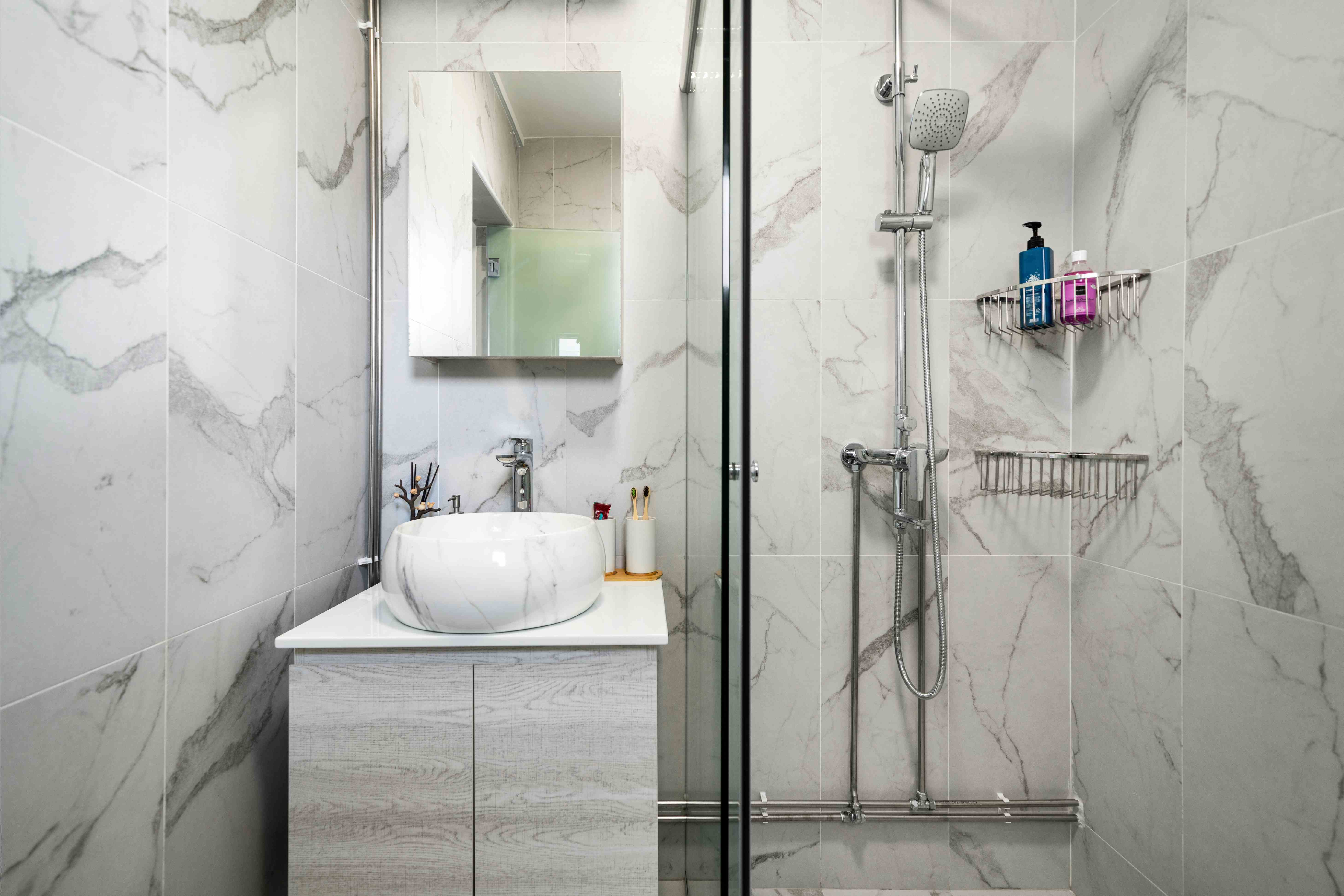 Vertically Aligned White Tiles For Compact Bathroom | Livspace