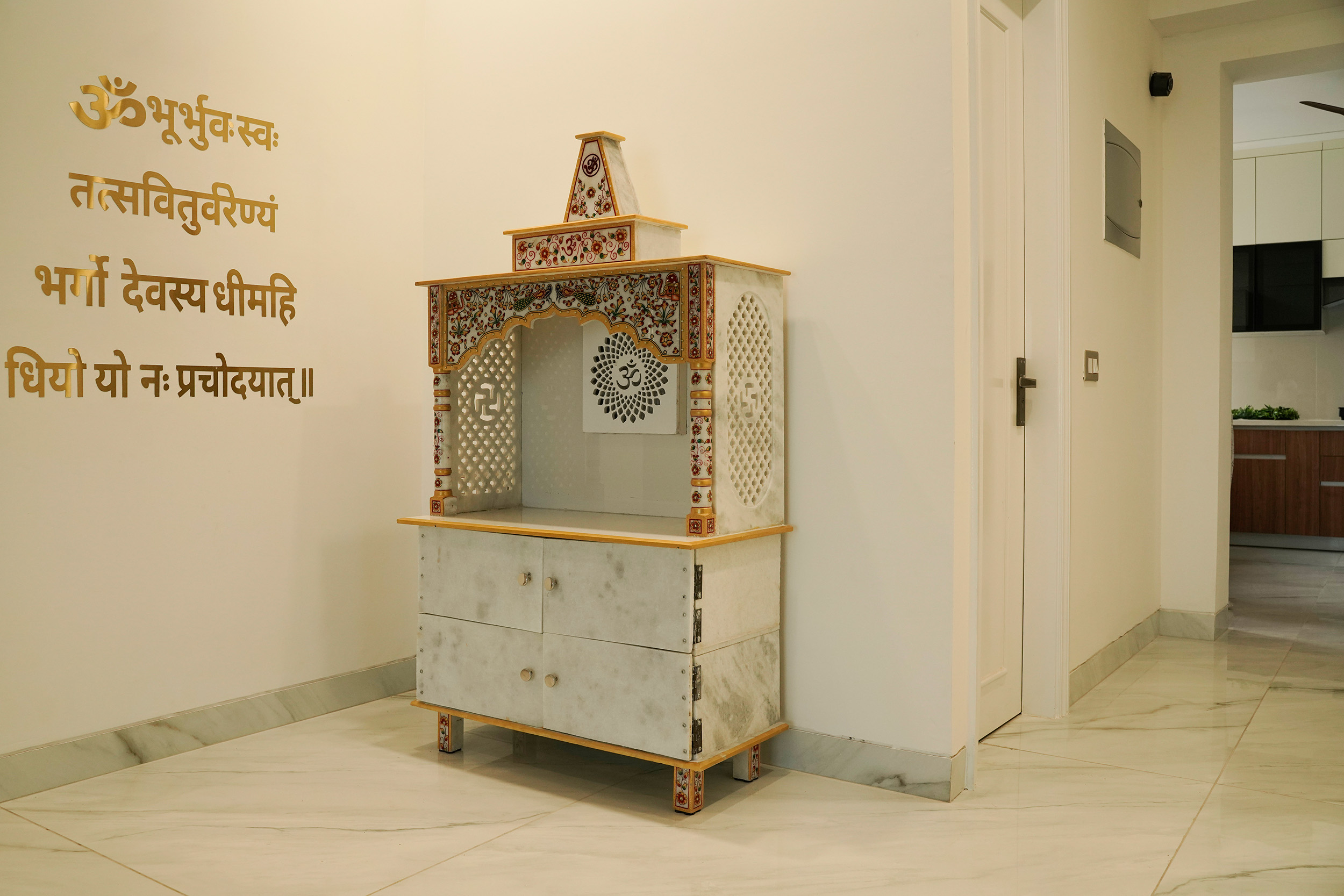 Indian Traditional Pooja Room Design with Om Symbol and Motifs | Livspace