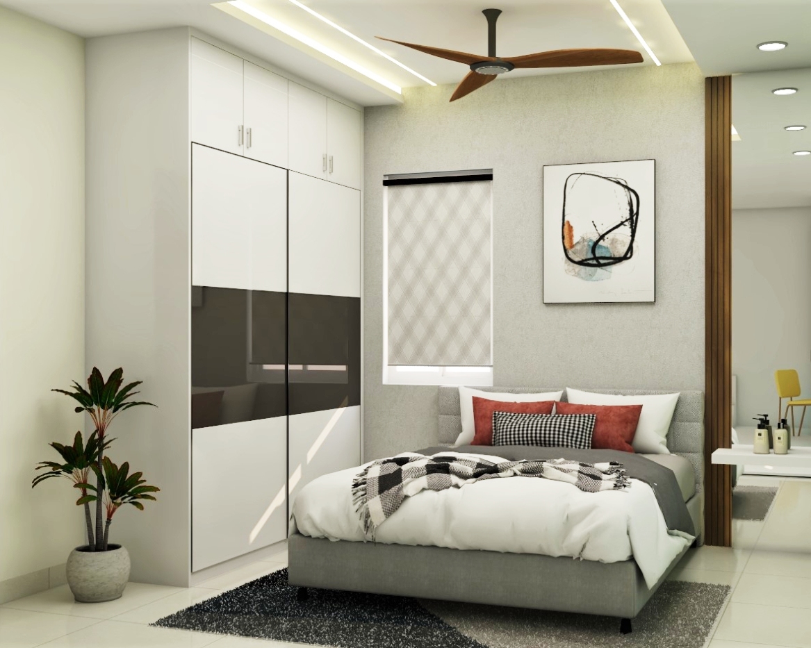 Compact Guest Room Design With Sliding Wardrobe And Wallpaper | Livspace