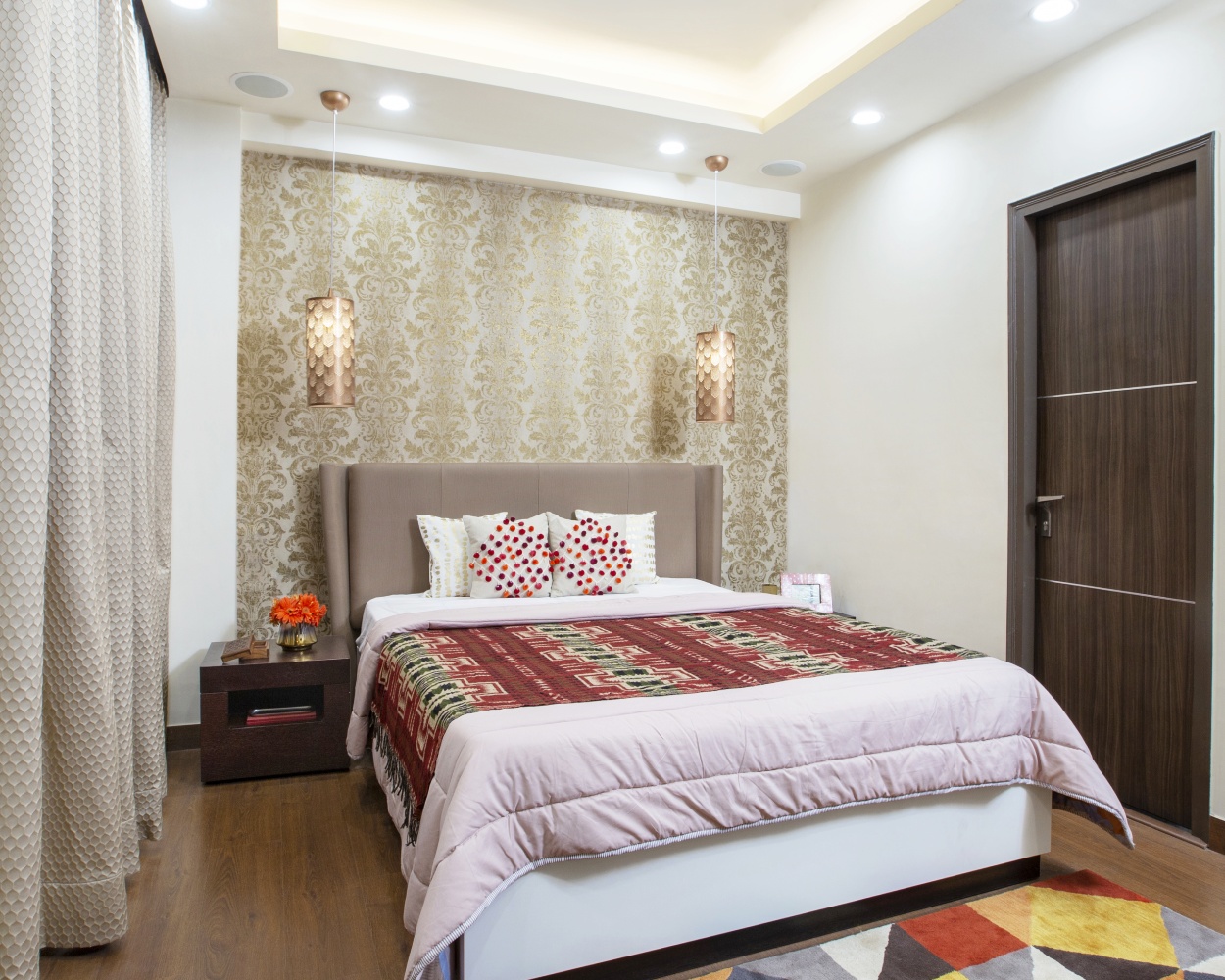 Patterned Bedroom Wallpaper Design With Wall Lamps | Livspace