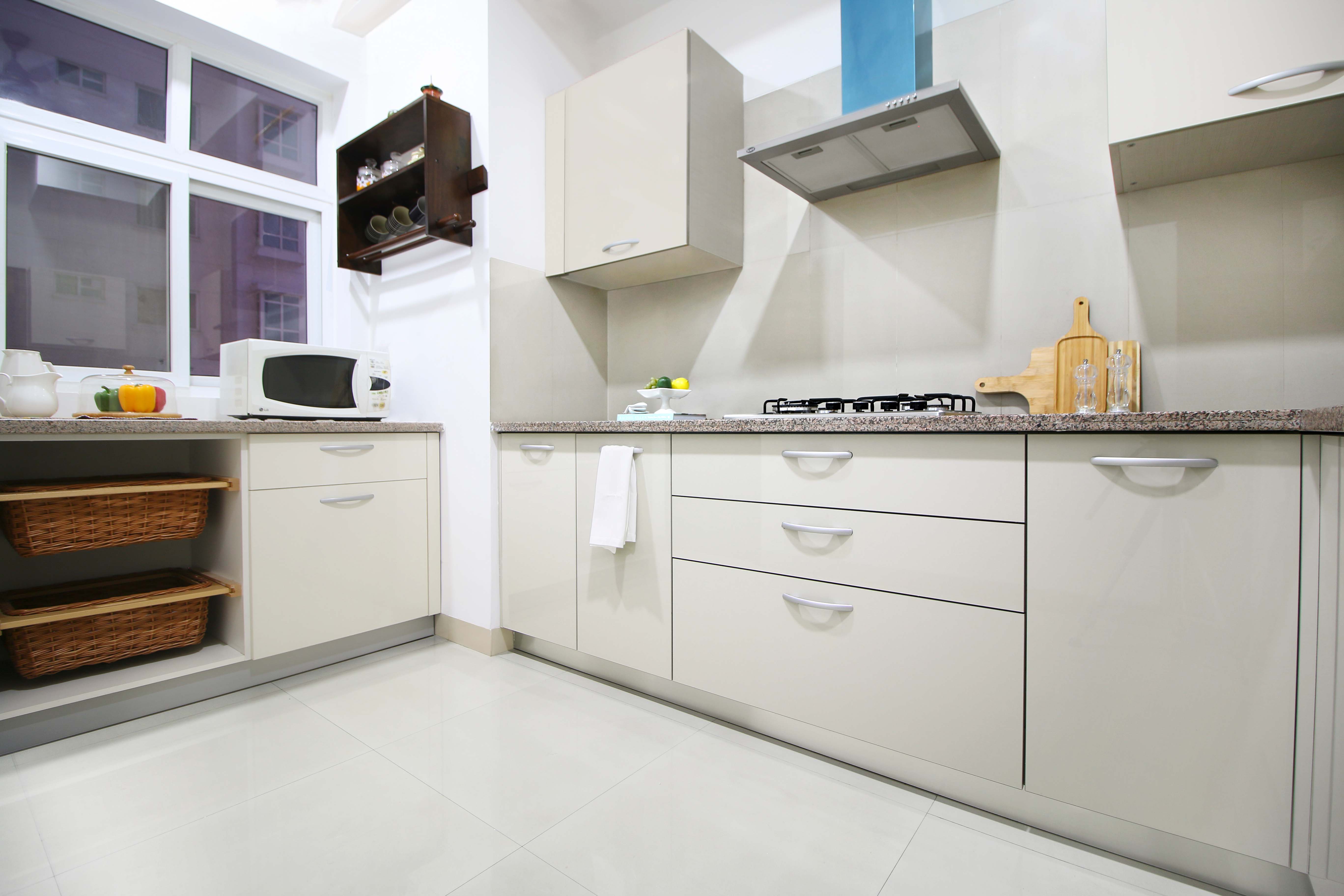 Open Modern Modular Kitchen Design With Champagne-Toned Cabinets | Livspace