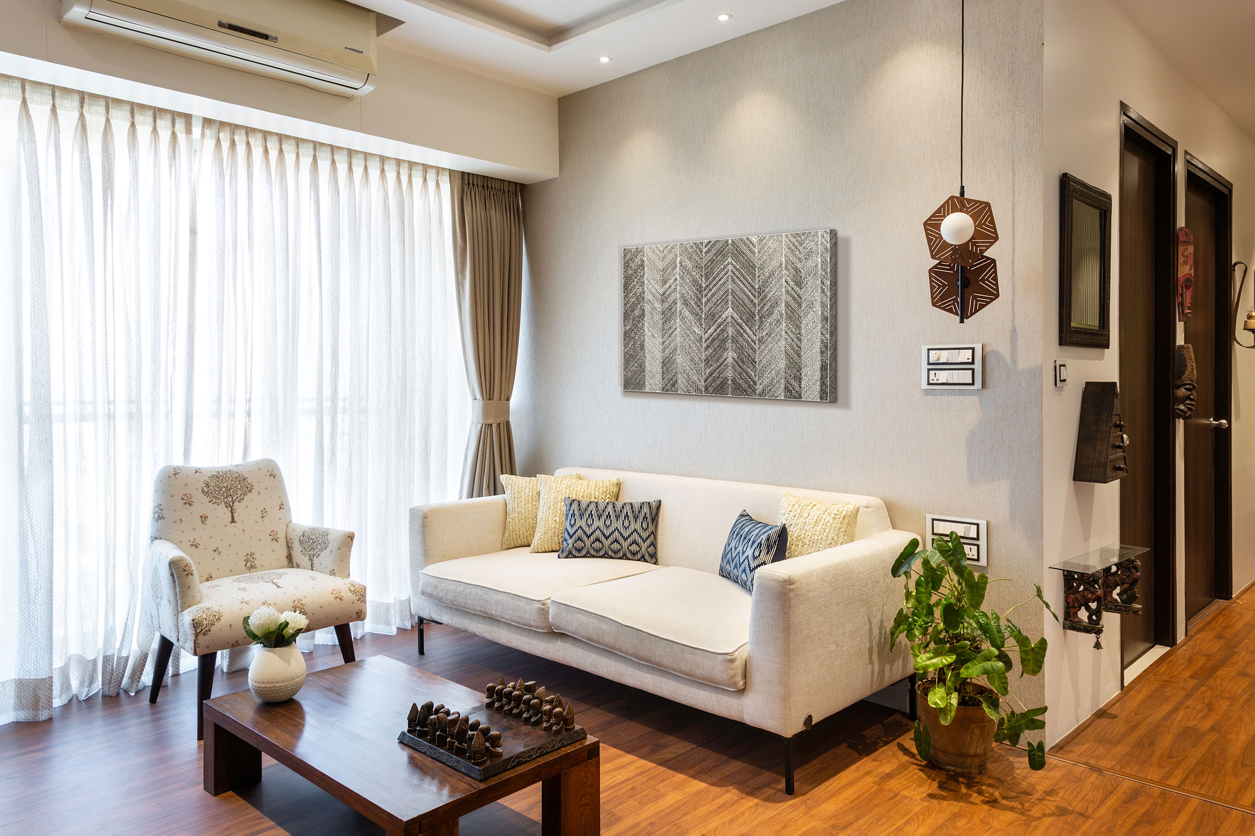 2-BHK Flat In Mumbai With Wooden Flute TV Unit Design | Livspace