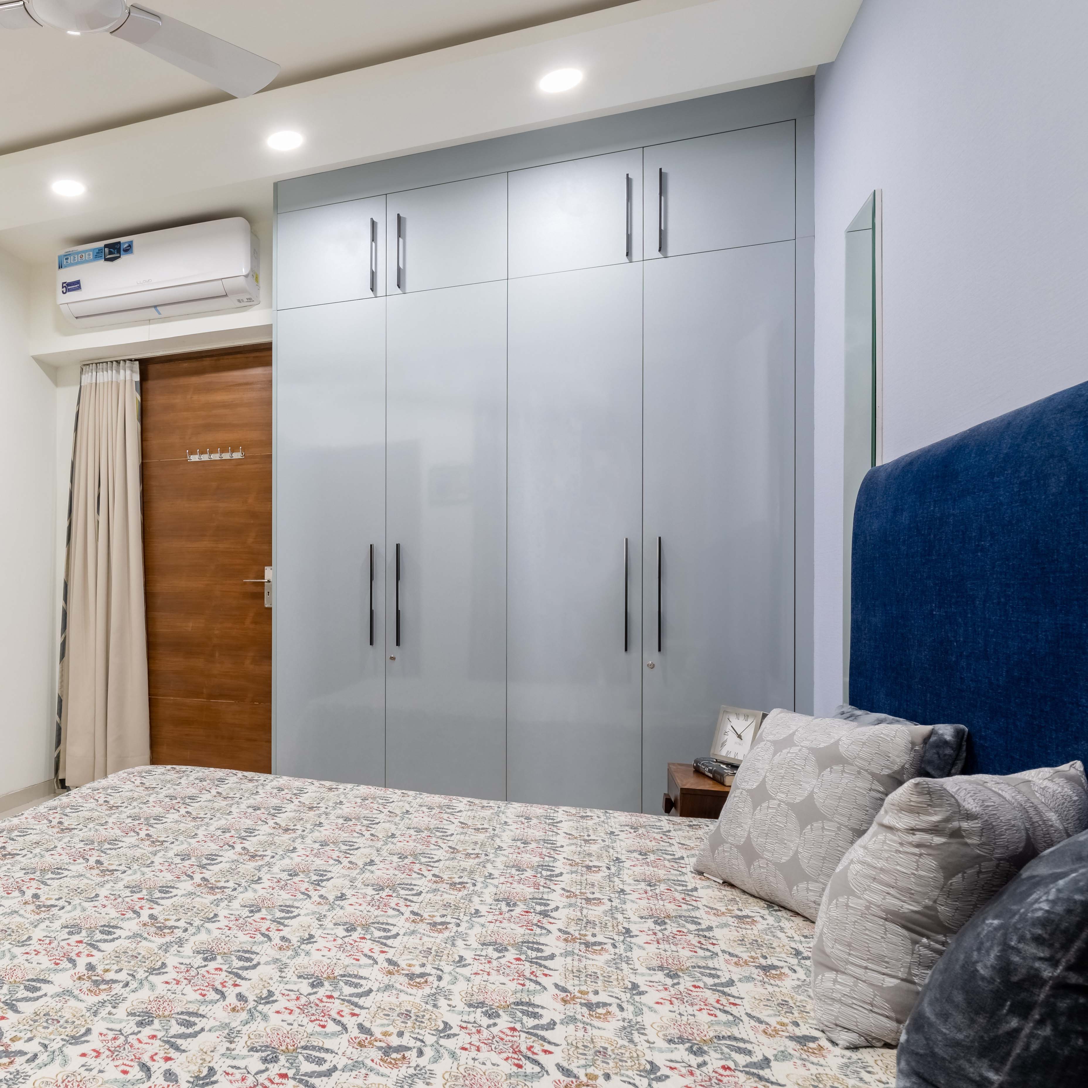 Stylish Modern Silver Frost Glossy and Loft Wardrobe Design | Livspace