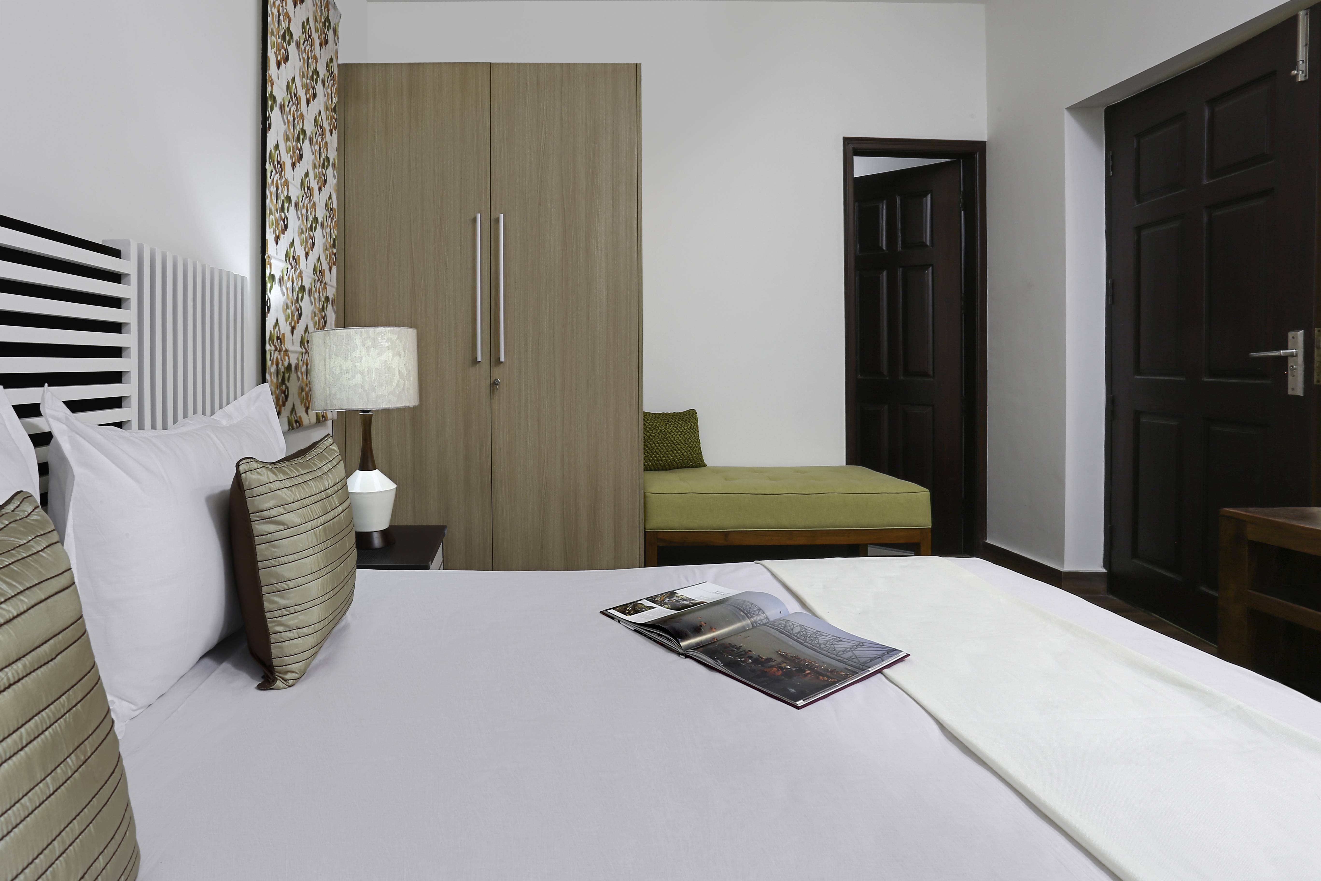 Compact Guest Room Design In White | Livspace