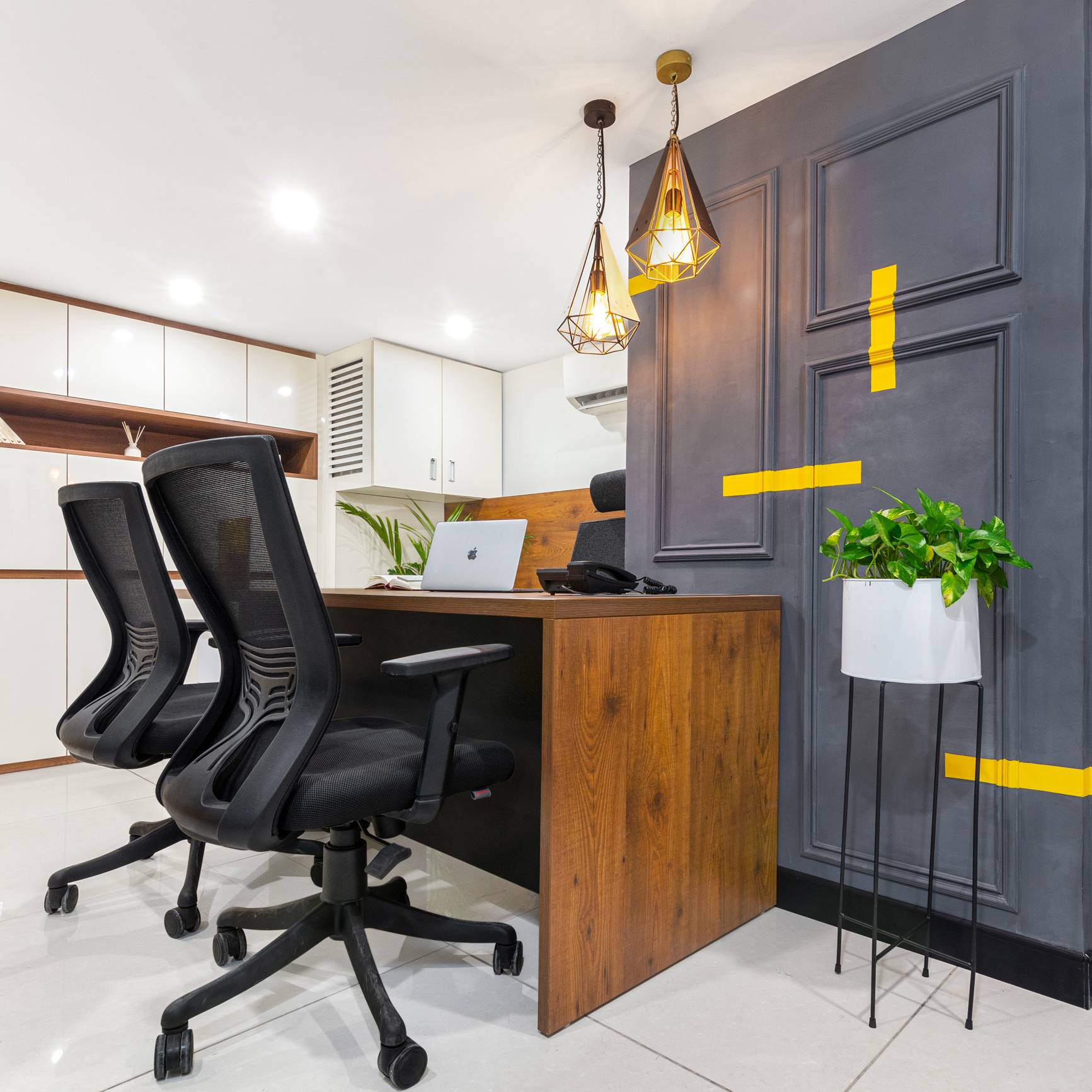 Study Room Design With A Wooden Table And Black Chairs | Livspace