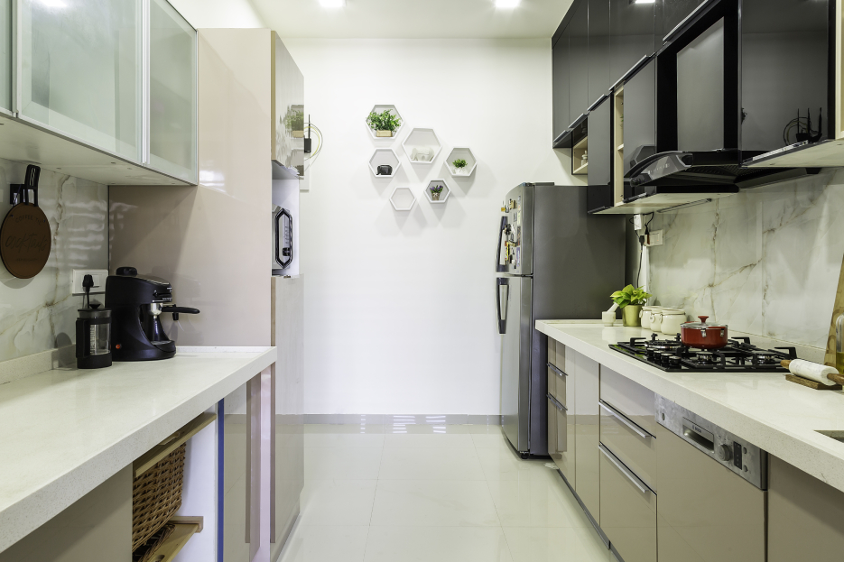 Compact Parallel Kitchen Design With Marble Tiles | Livspace