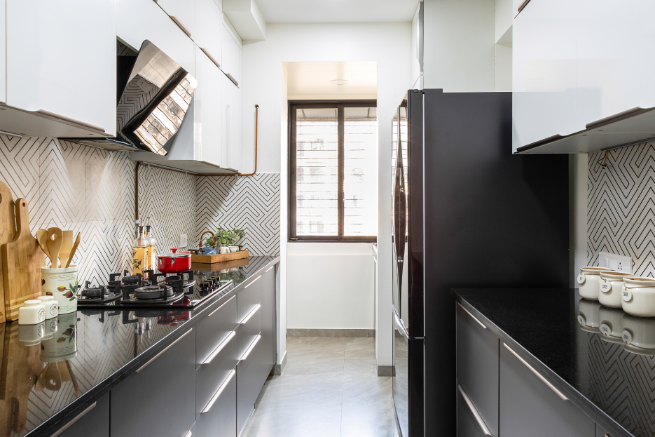 Parallel Kitchen Design With A Tall Storage Unit | Livspace