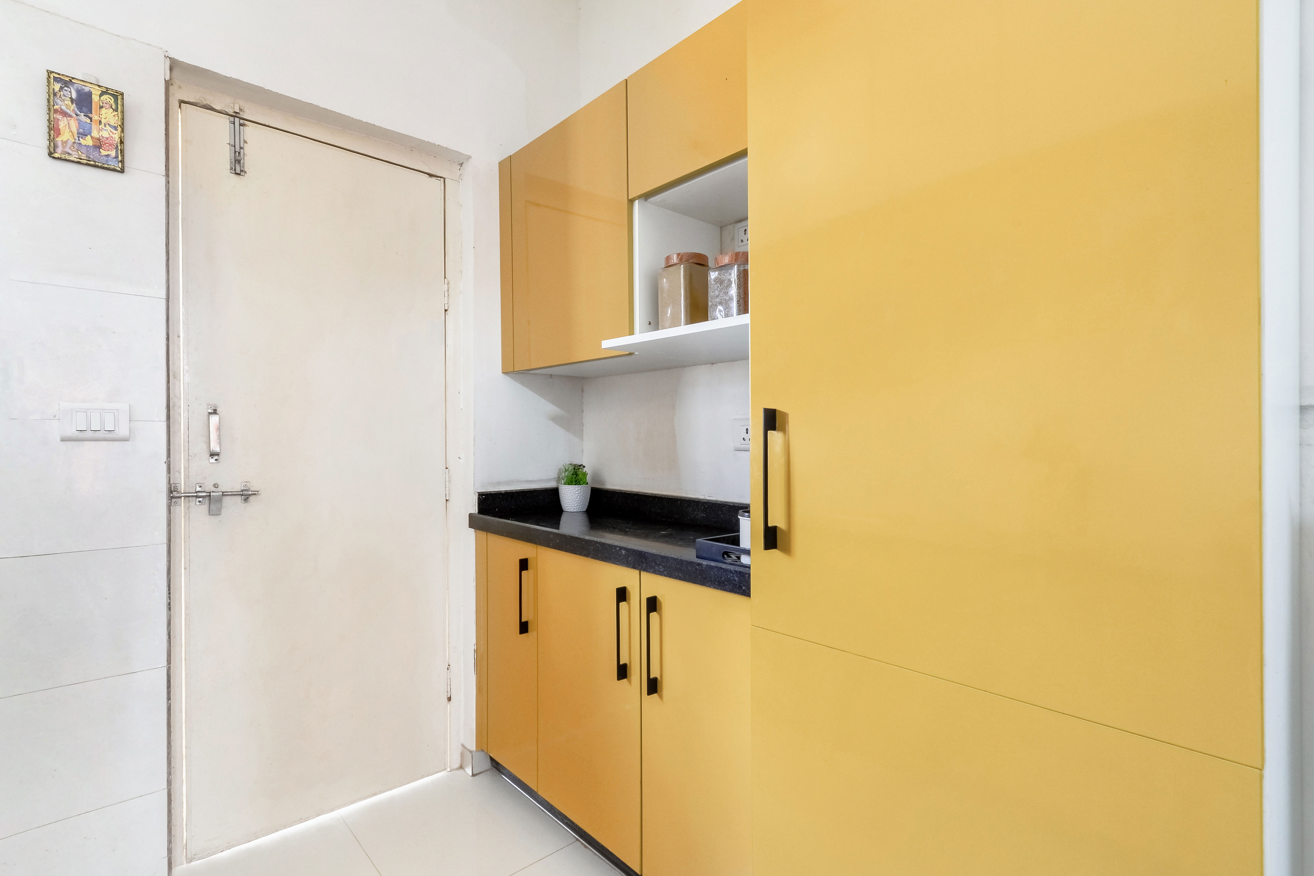 Spacious Kitchen Design With A Tall Storage Unit | Livspace