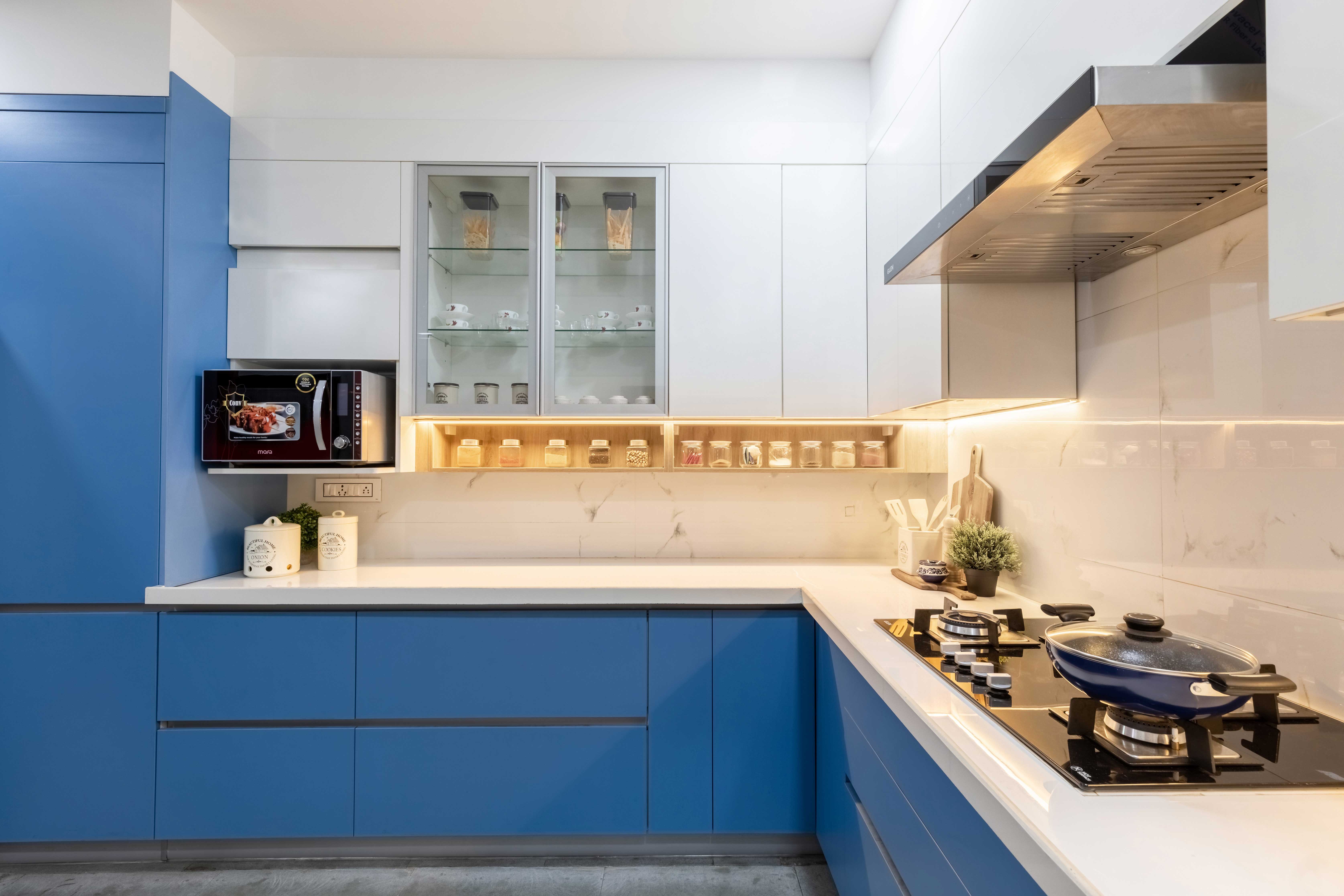 Blue And White Spacious Kitchen Design | Livspace