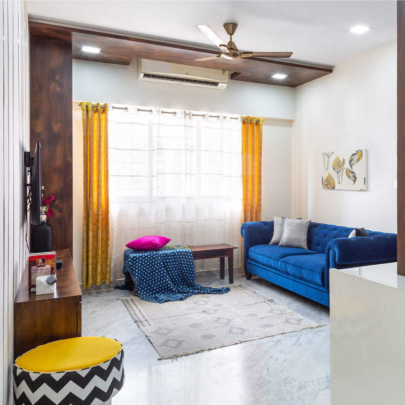 Compact Drawing Room Design With Wooden Centre Table | Livspace