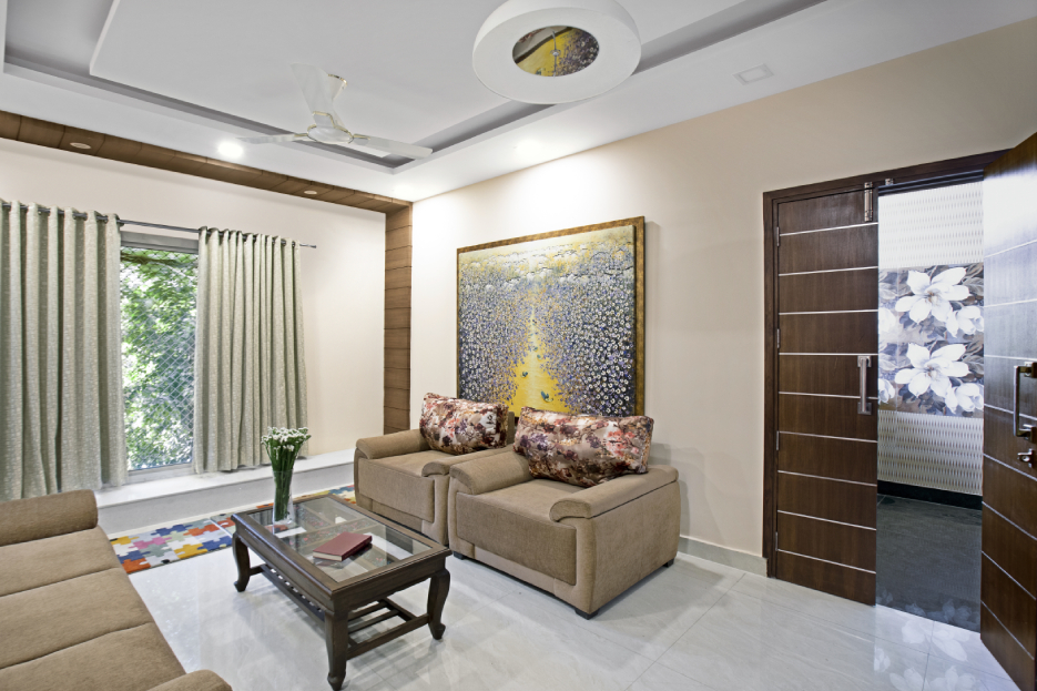 Beige Wall Paint Design With Wall Art | Livspace