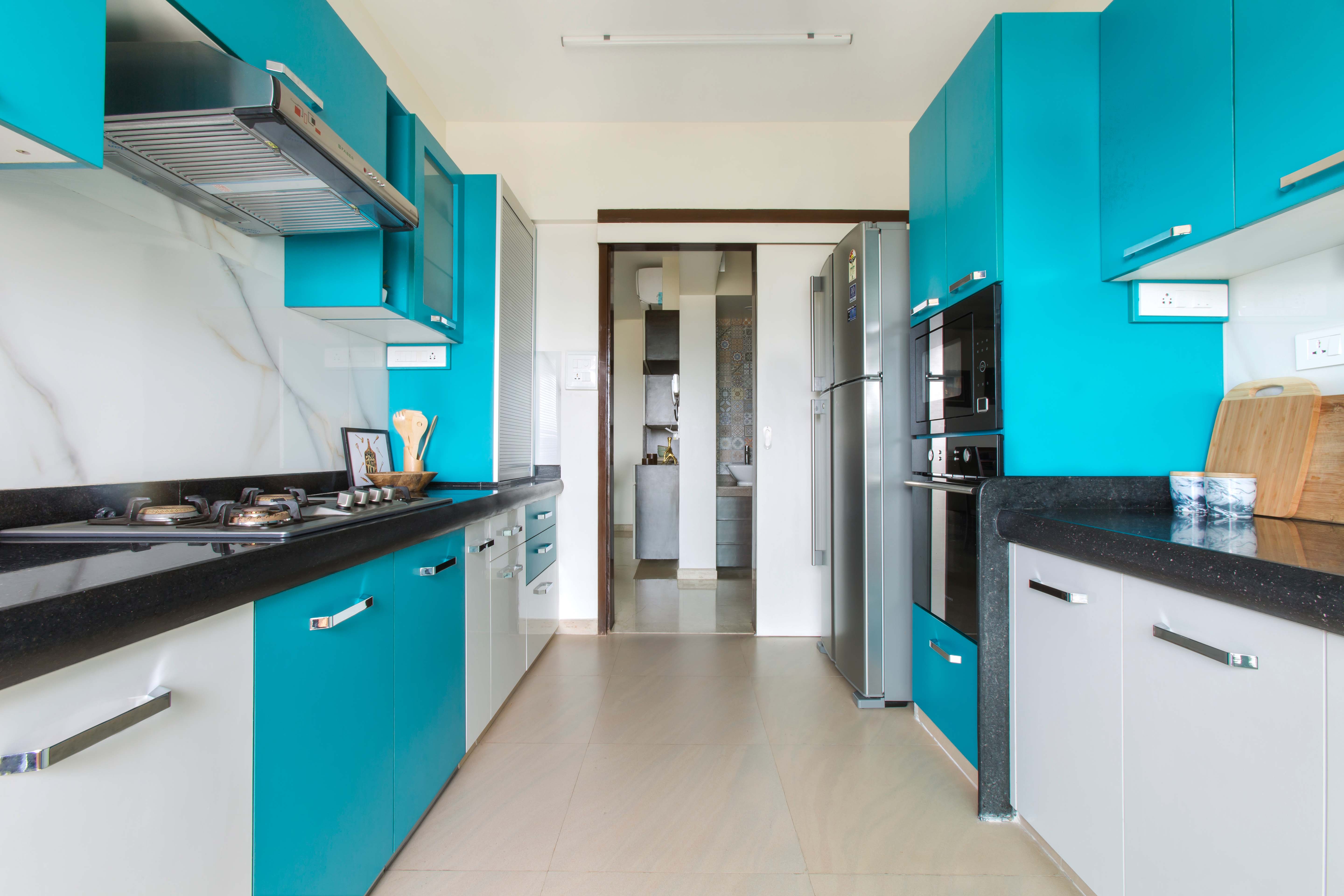 Mumbai 2-BHK Interior With Blue And White Modular Parallel Kitchen ...