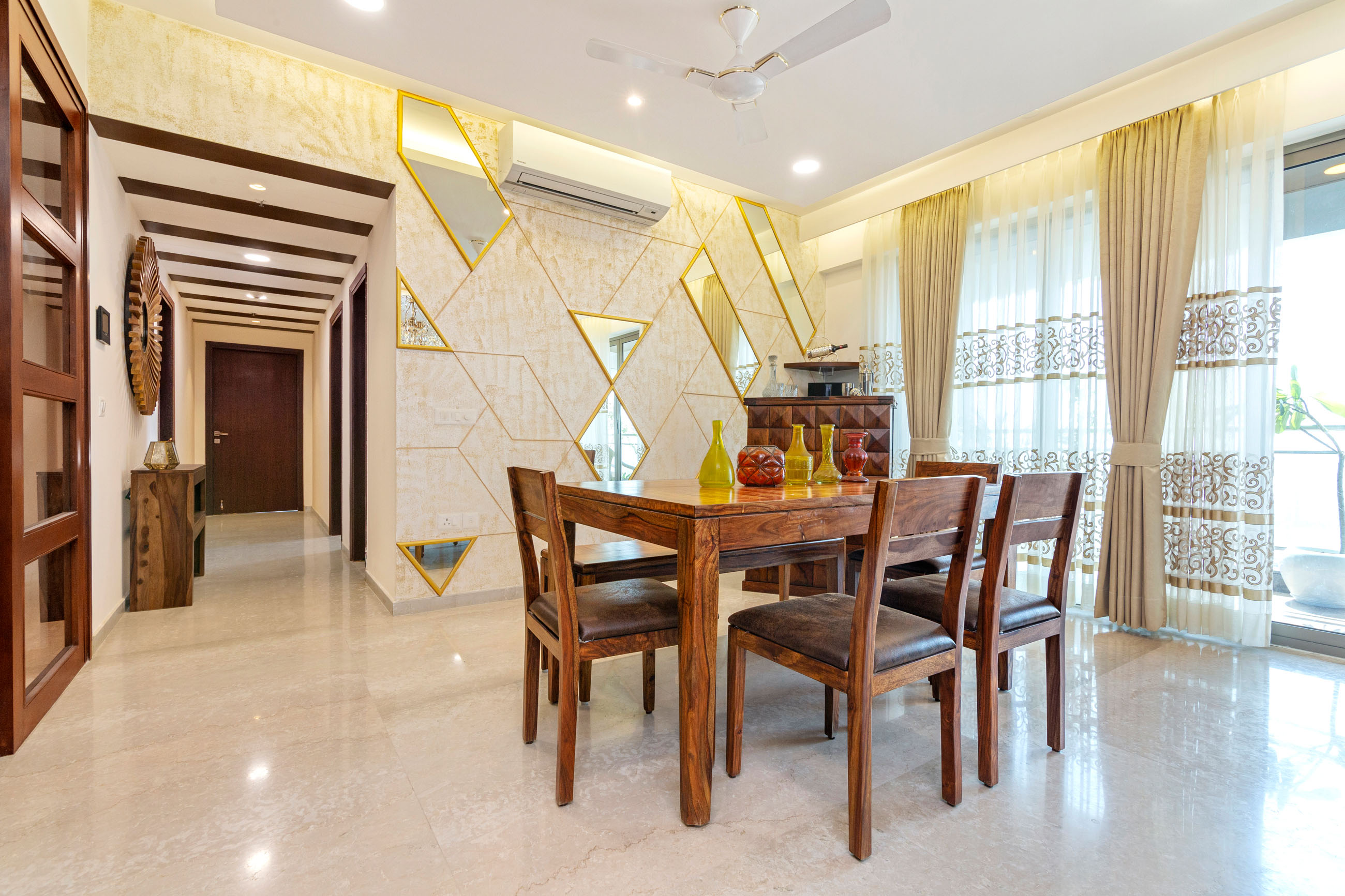 Wooden 4-Seater Dining Room Design With Beige Textured Wall And ...