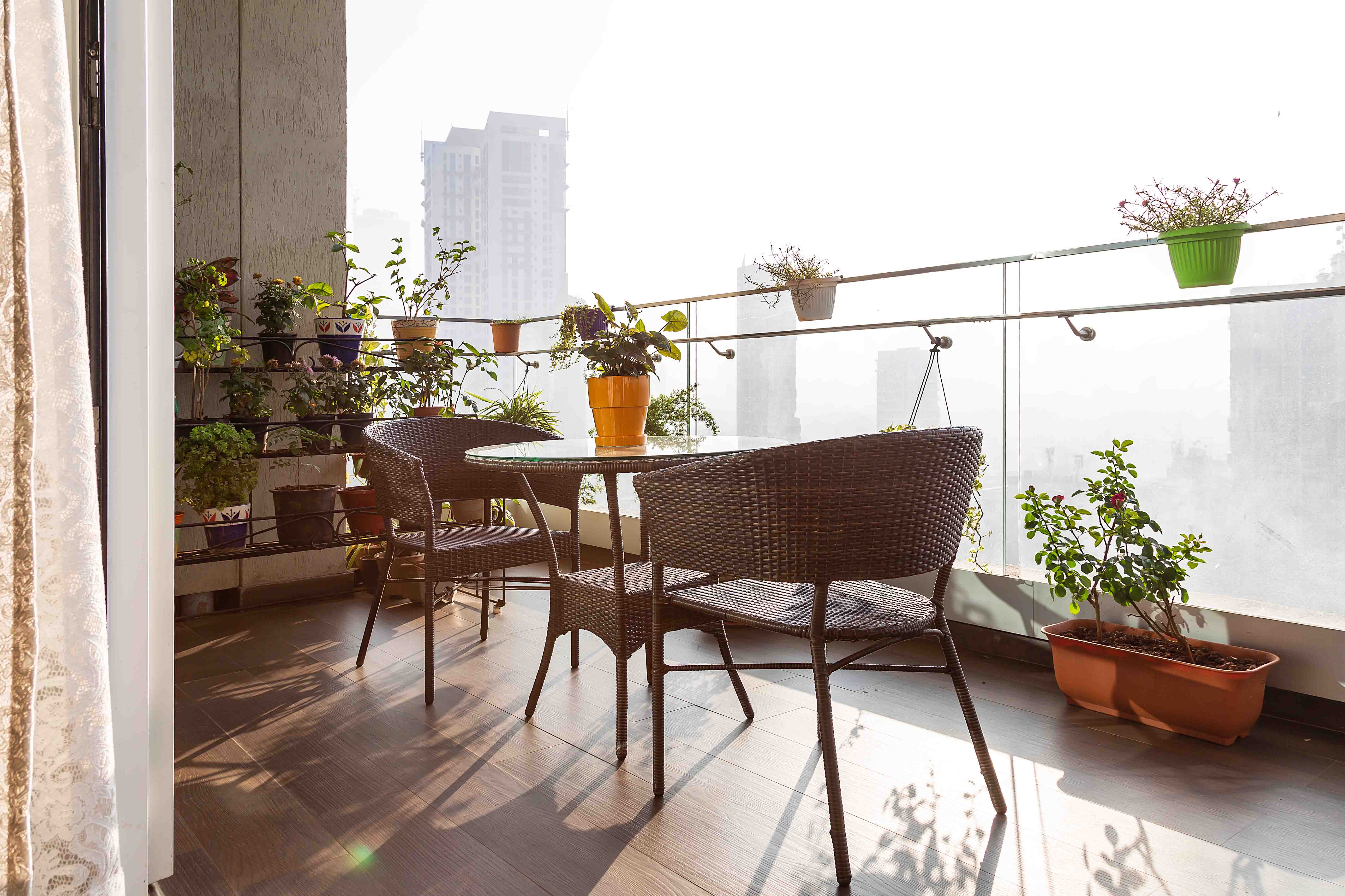 Balcony Design With Dark Woven Chairs | Livspace