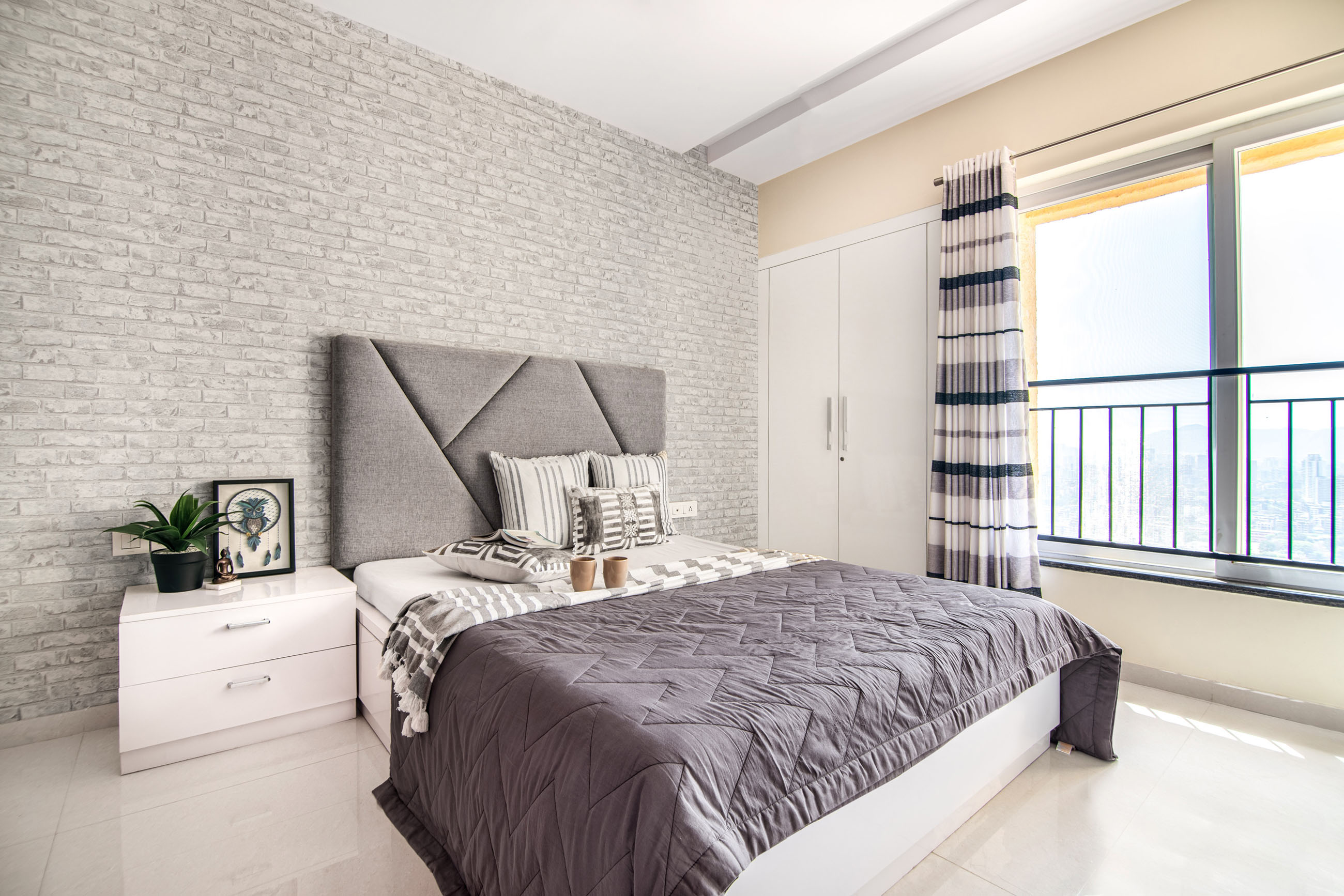 Guest Room Design With Grey Stone Cladding | Livspace