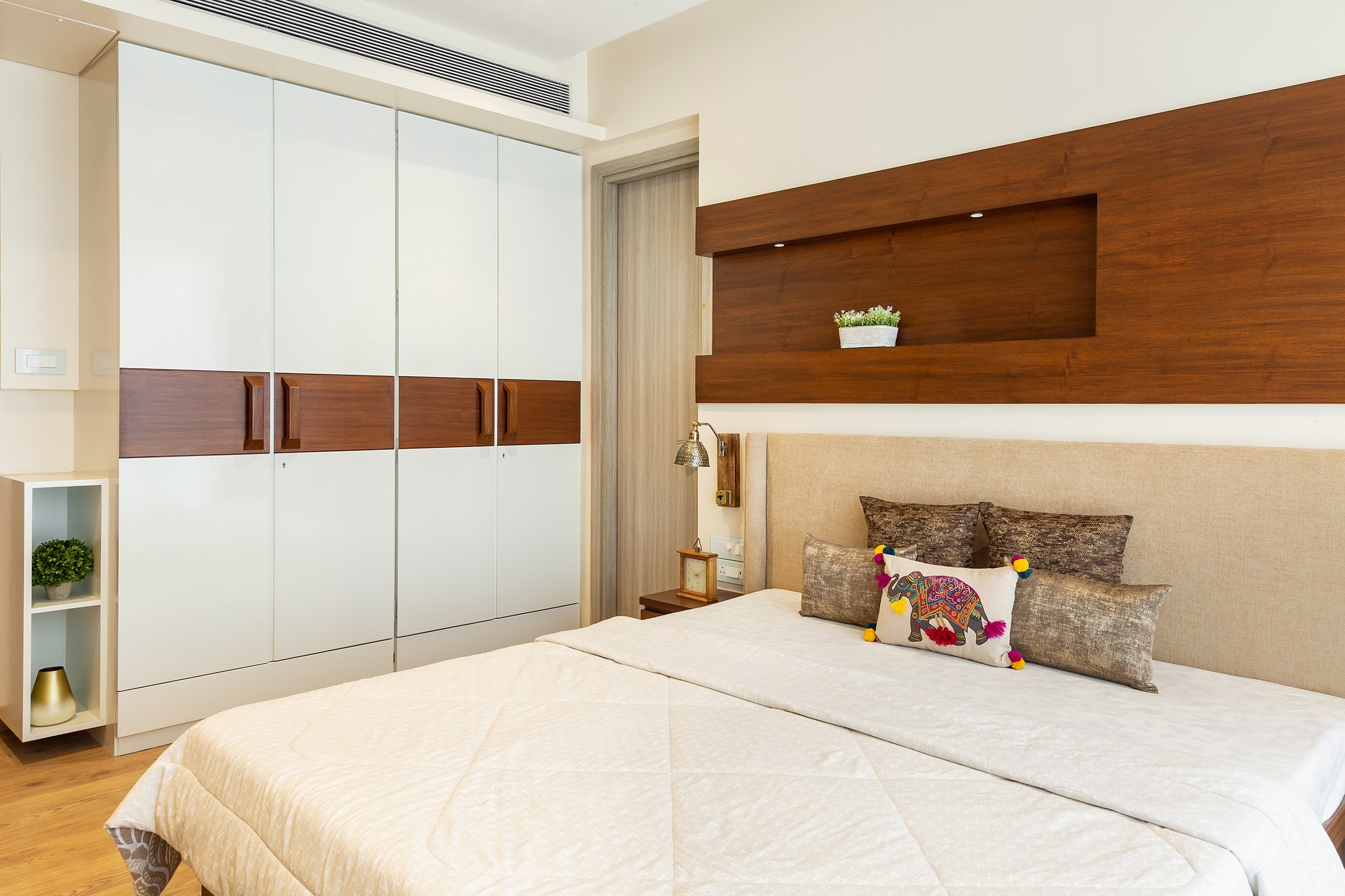 Master Bedroom Design With Wooden Wall Panelling And Flooring | Livspace